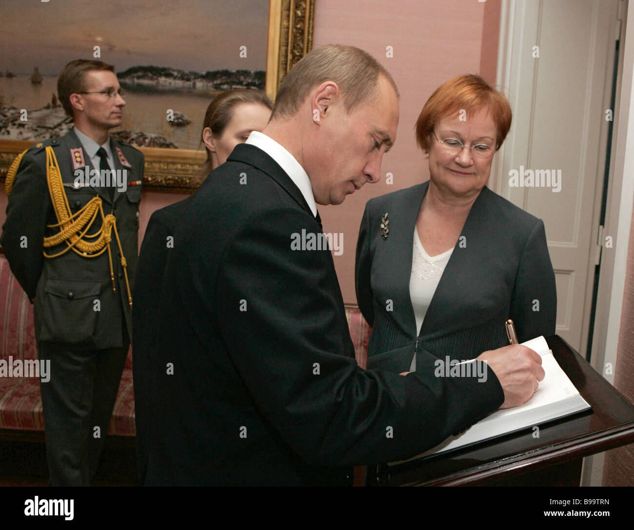 Russian President Vladimir Putin signs Visitors Book in Finnish ...