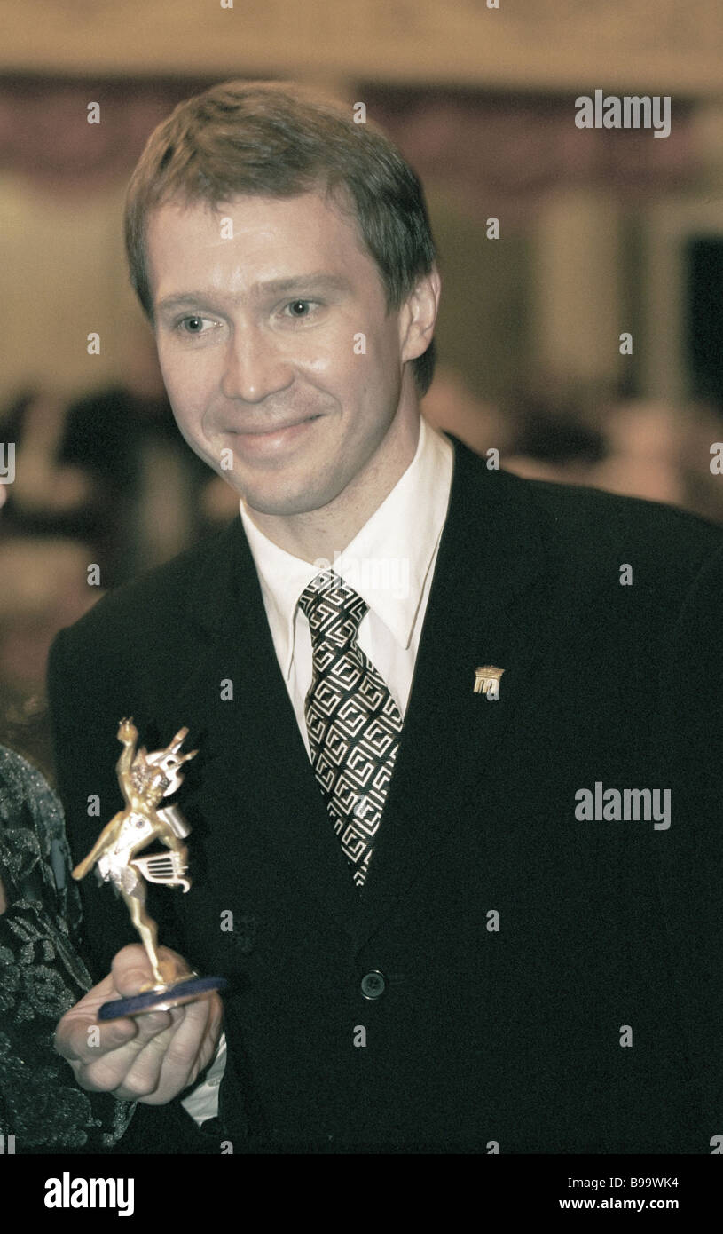 Russian merited actor Yevgeny Mironov receiving the figurine Golden Elf ...