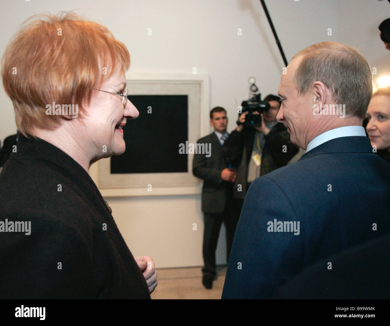Presidents Tarja Halonen of Finland and Vladimir Putin of Russia look ...