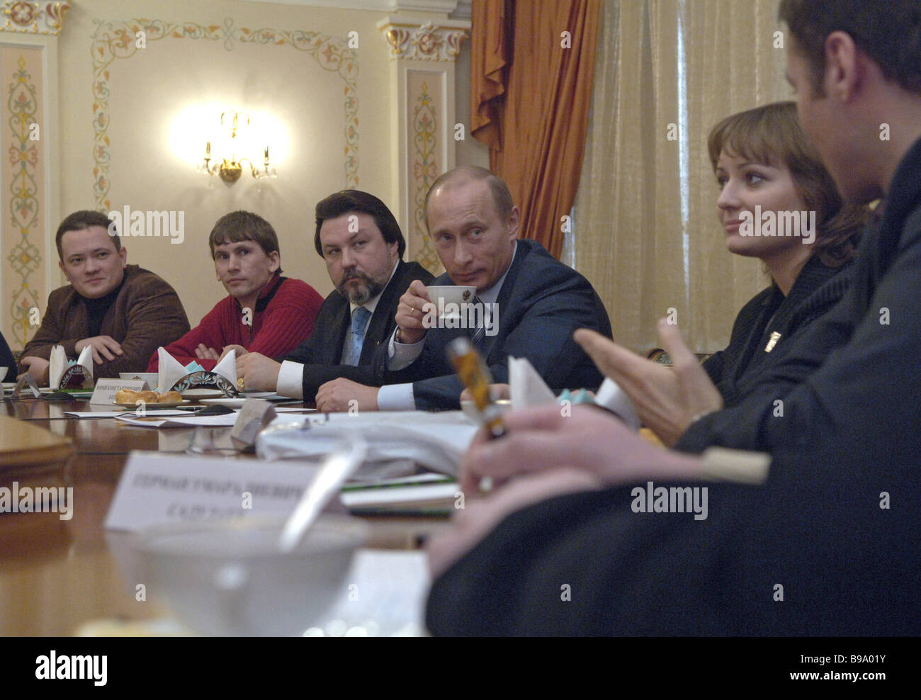 President Vladimir Putin center and his advisor Yury Laptev third left ...