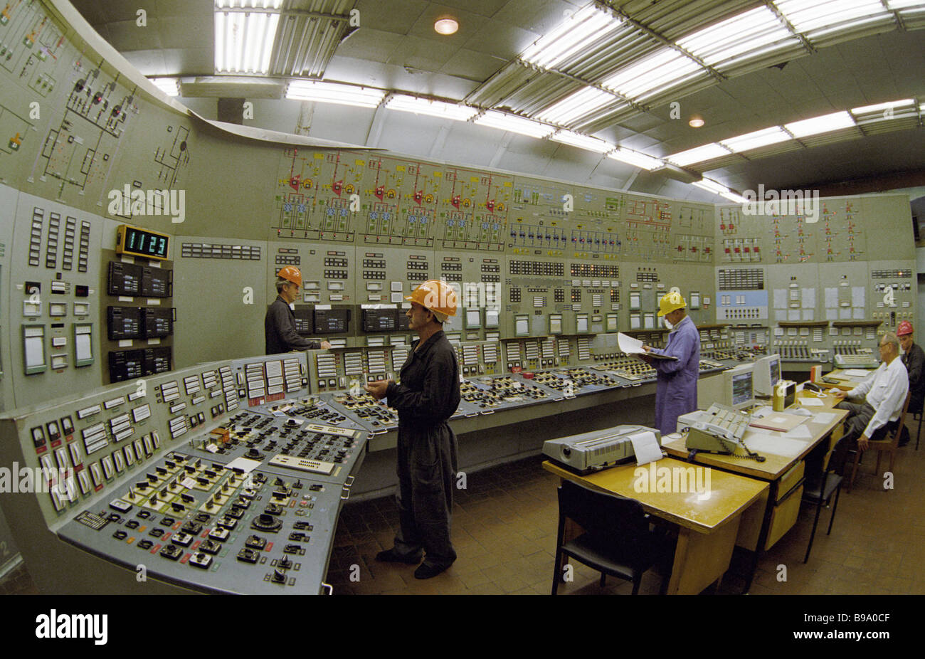 Workers of spent nuclear fuel regeneration factory at central heat ...