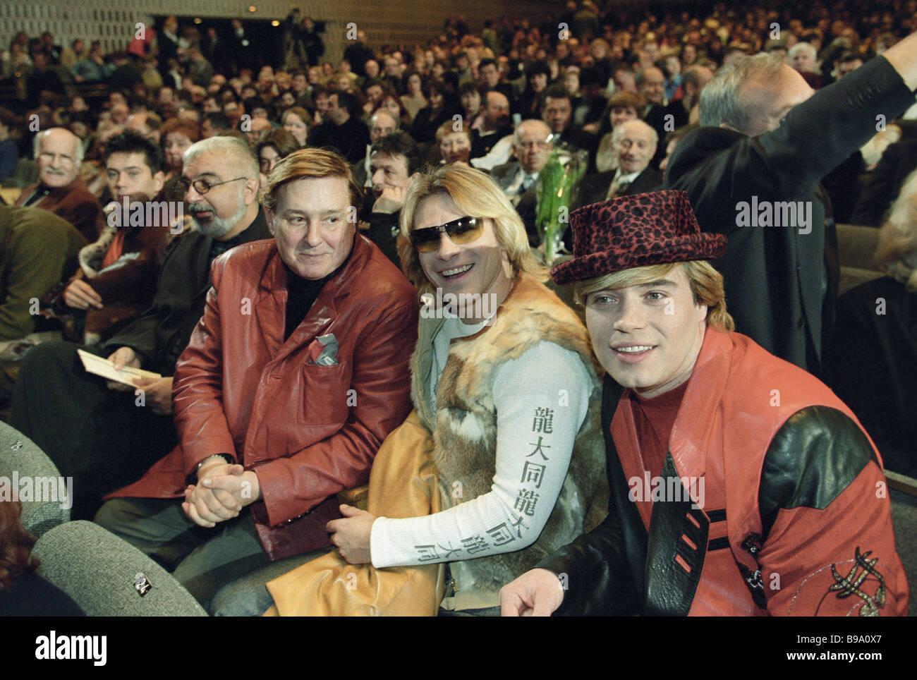 Theater director Roman Viktyuk third right and soloists of Na Na music ...