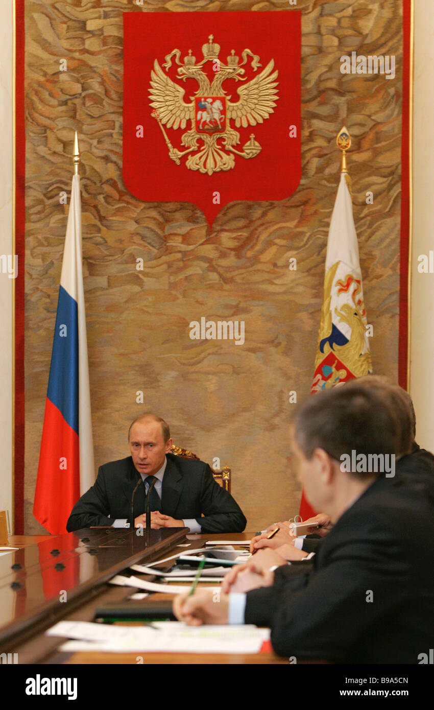 Russian President Vladimir Putin left during a conference with the ...