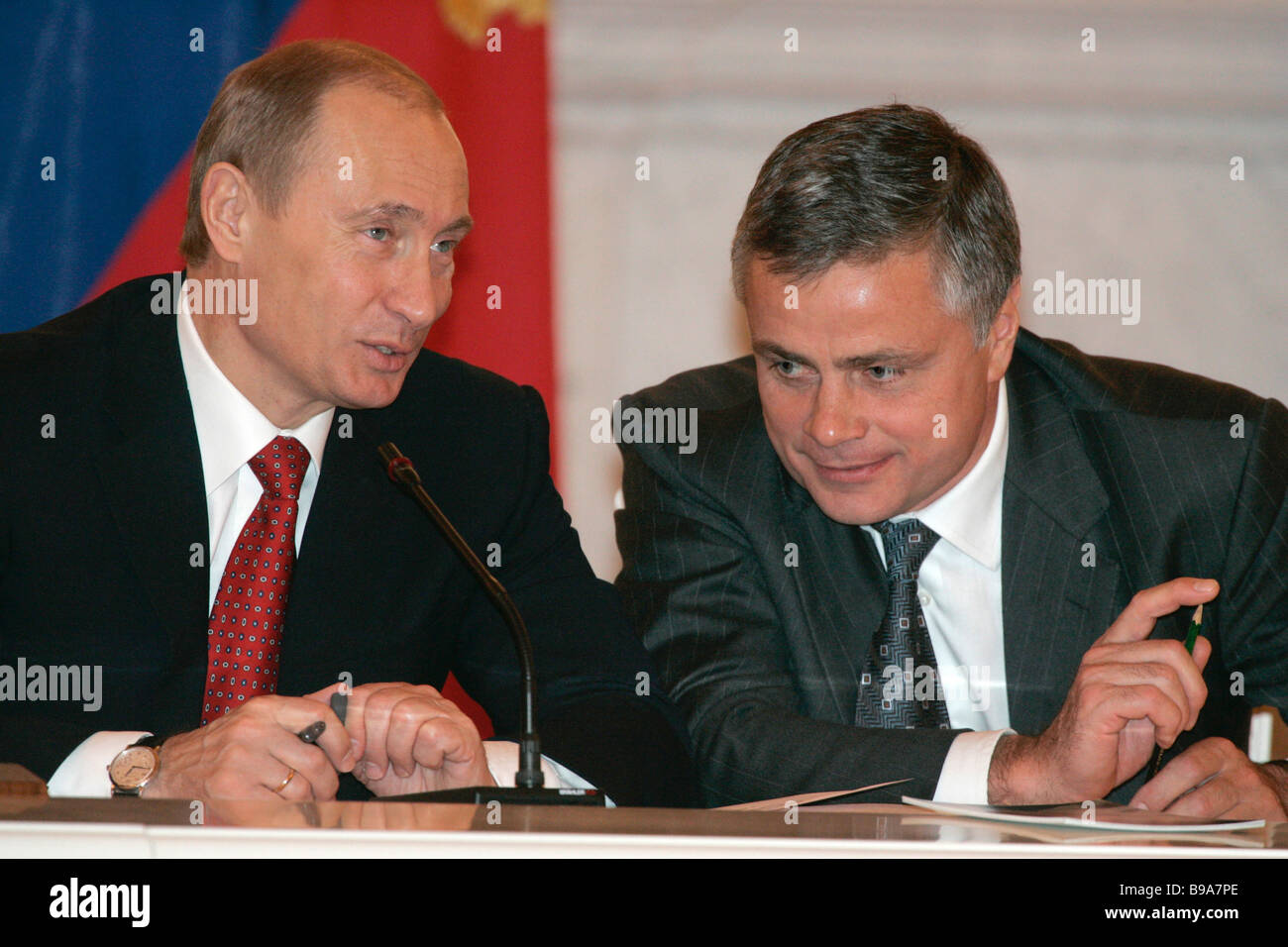 Russian President Vladimir Putin and his aide Alexander Abramov left to ...