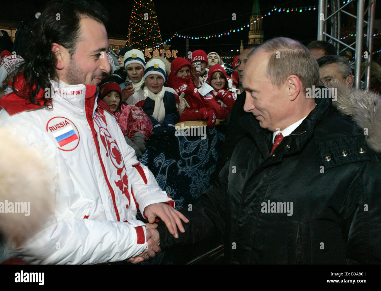 Russian President Vladimir Putin greets figure skater Ilya Averbukh ...