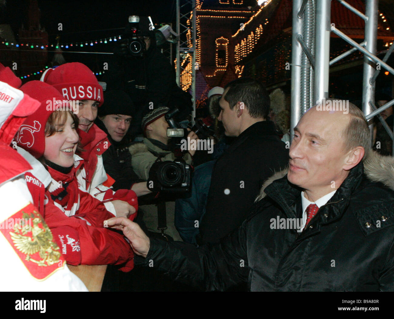 Russian President Vladimir Putin talks to children while visiting the ...
