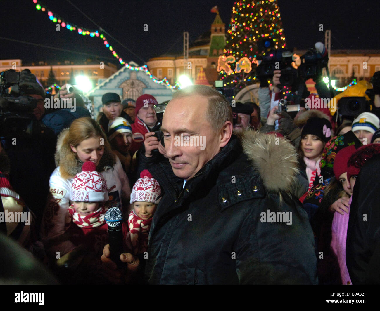 Russian President Vladimir Putin talks to children while visiting the ...