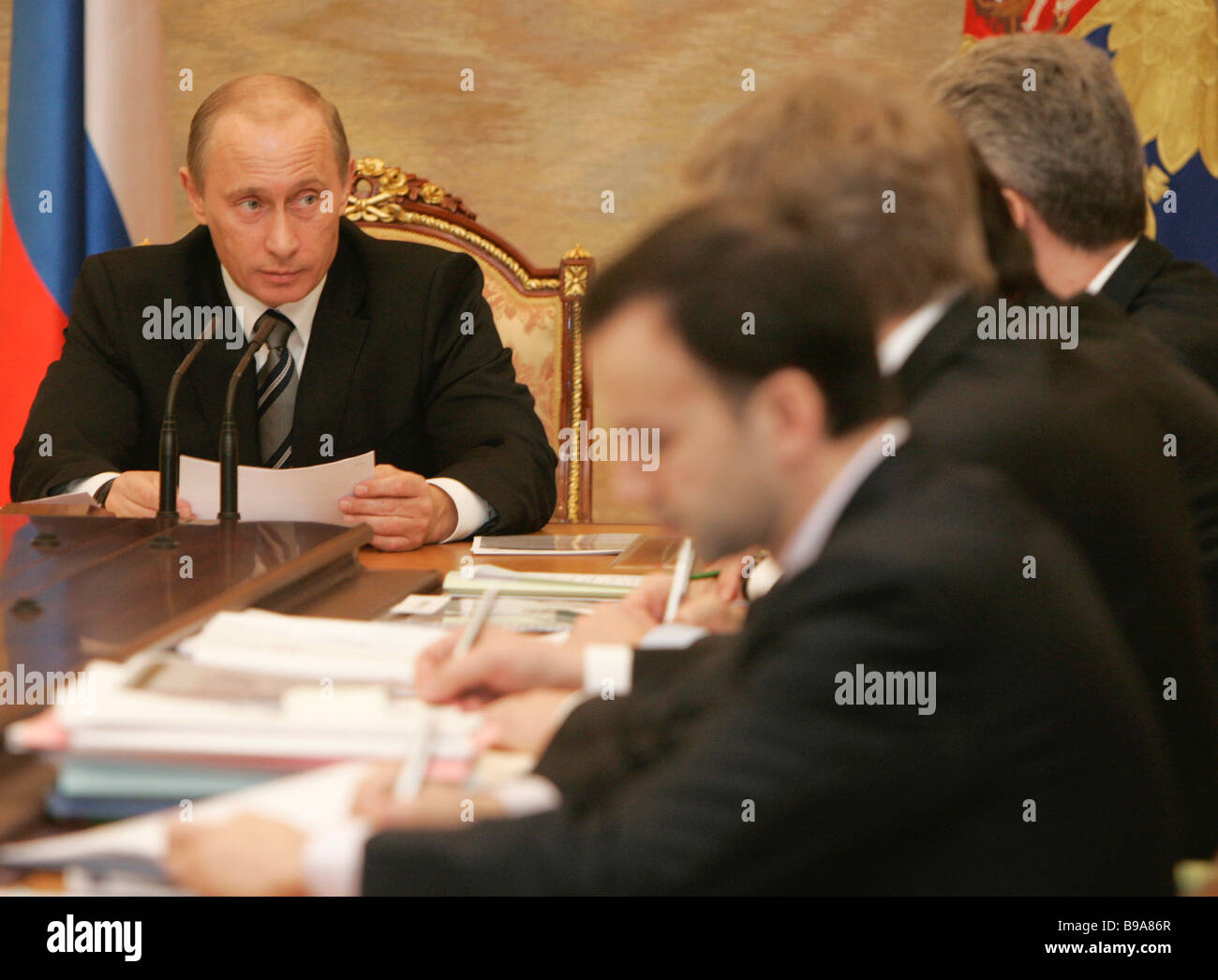 Russian President Vladimir Putin left holding a conference on economic ...