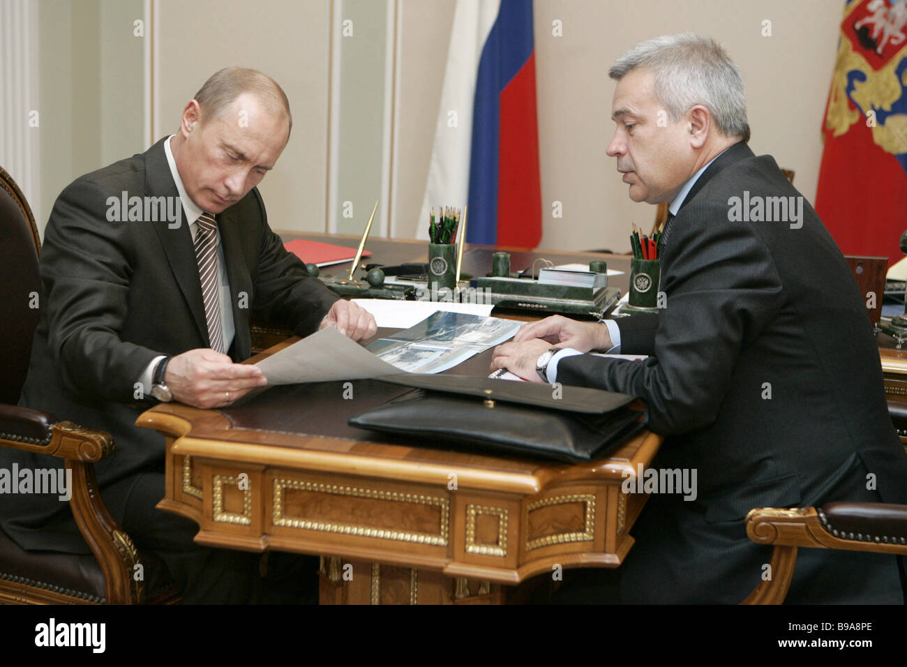 President Vladimir Putin and the LUKoil Company head Vagit Alekperov ...