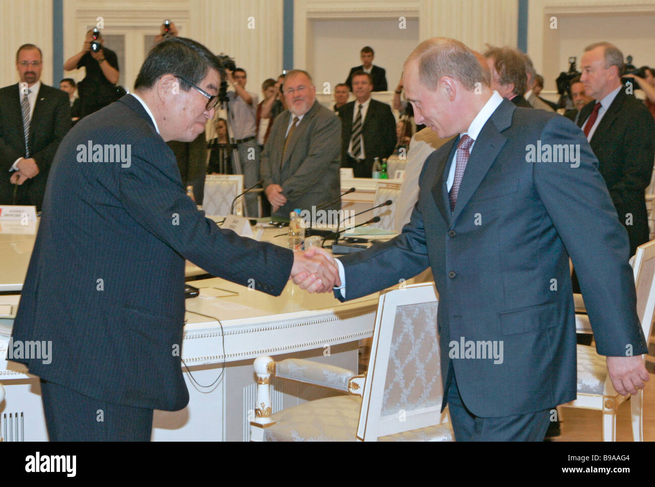 President of the Japanese Trade Union Confederation Tsujoshi Tagaki and ...