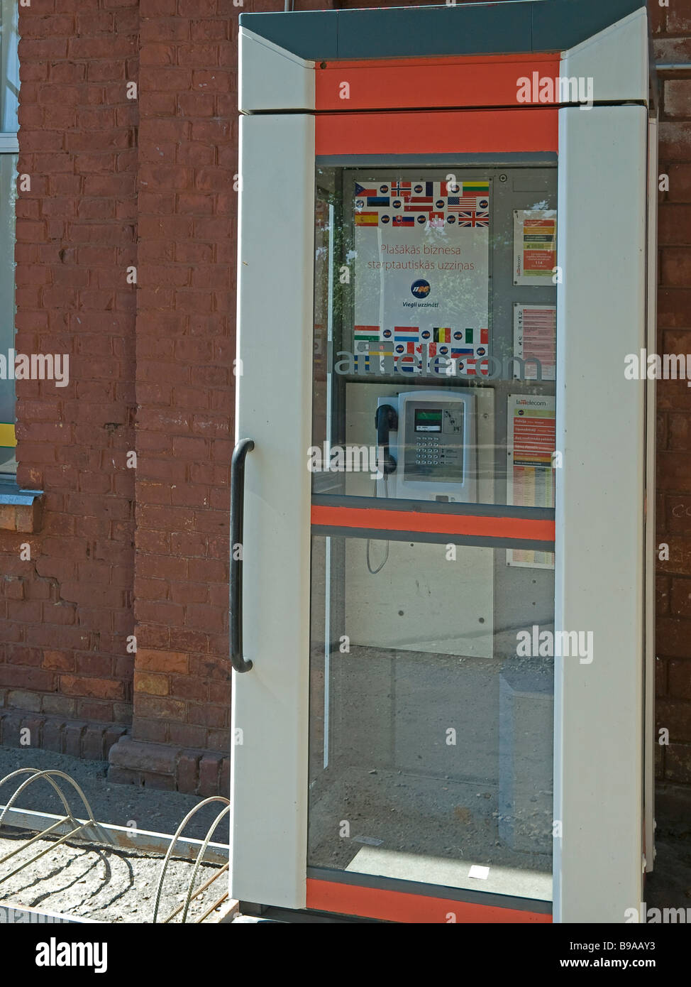 telephone cabin for long distance calls with flags for several ...