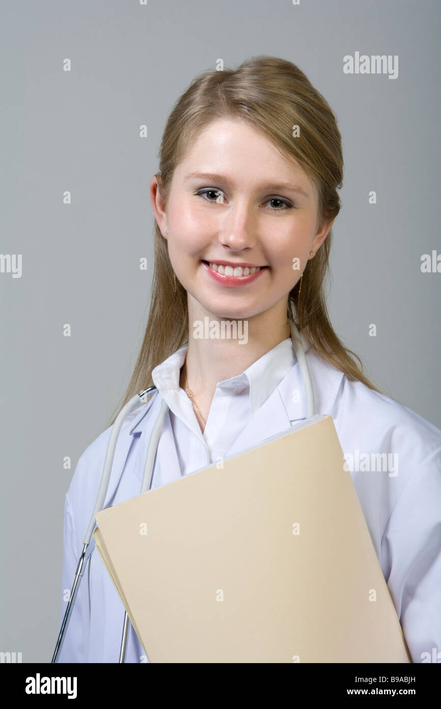 Female doctor holding patient file Stock Photo - Alamy
