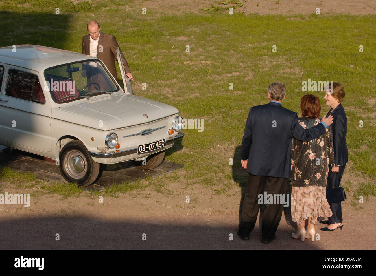 Russian President Vladimir Putin near the car and Lyudmila Putin ...