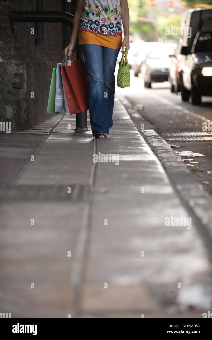 Woman sidewalk hi-res stock photography and images - Alamy