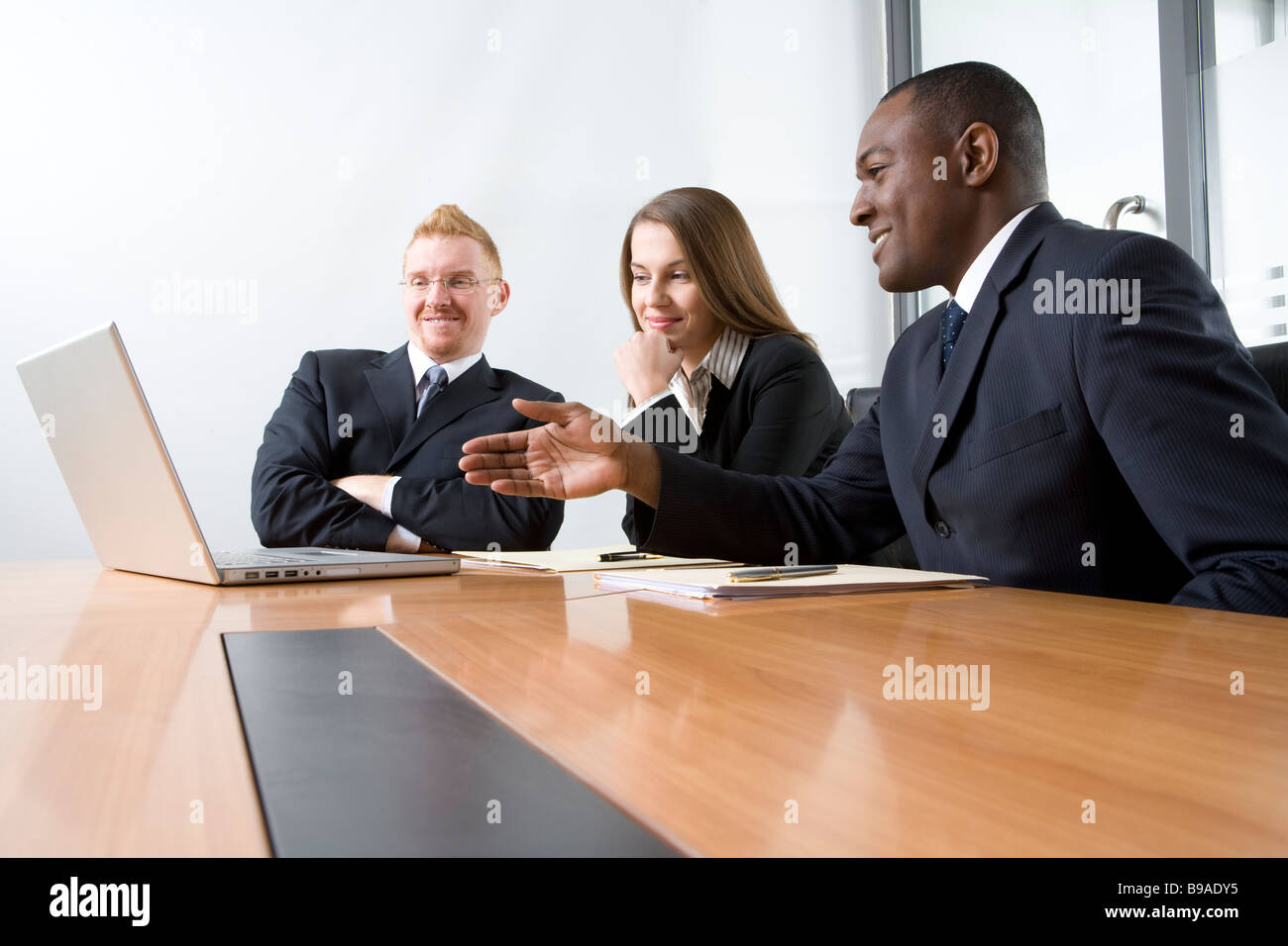 Co workers in business meeting Stock Photo - Alamy