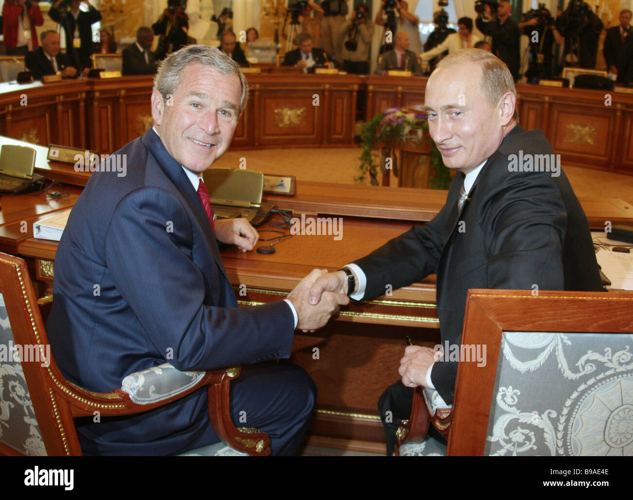 Presidents George Bush of the U S and Vladimir Putin of Russia left to ...