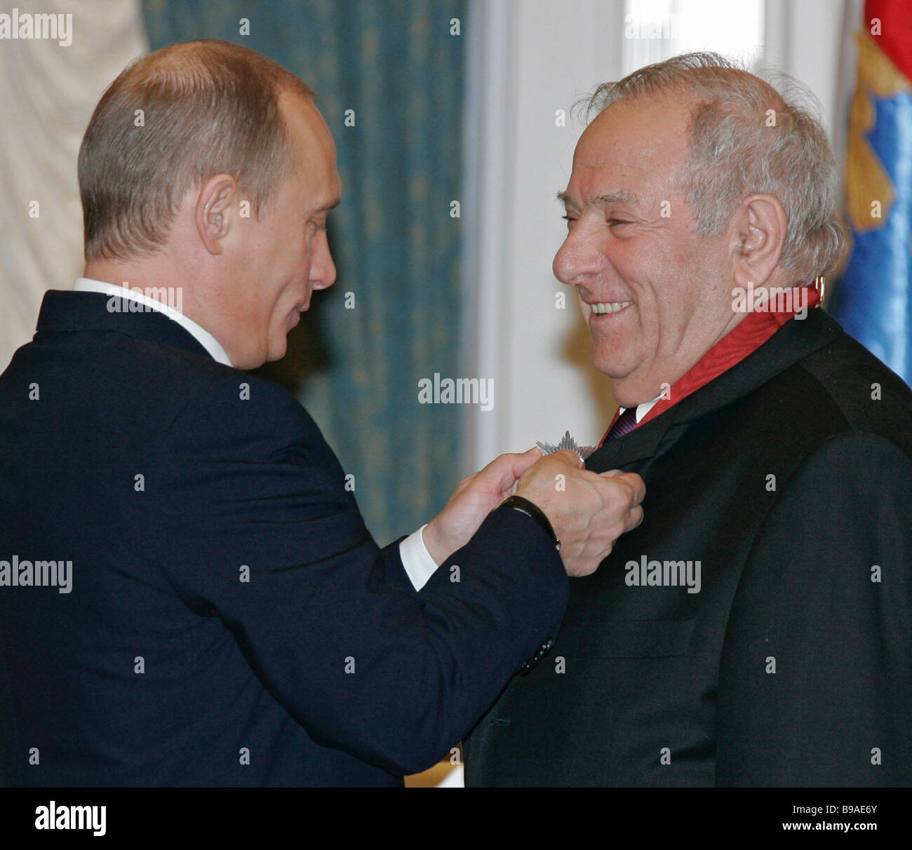 Russian President Vladimir Putin left giving director Pyotr Todorovsky ...