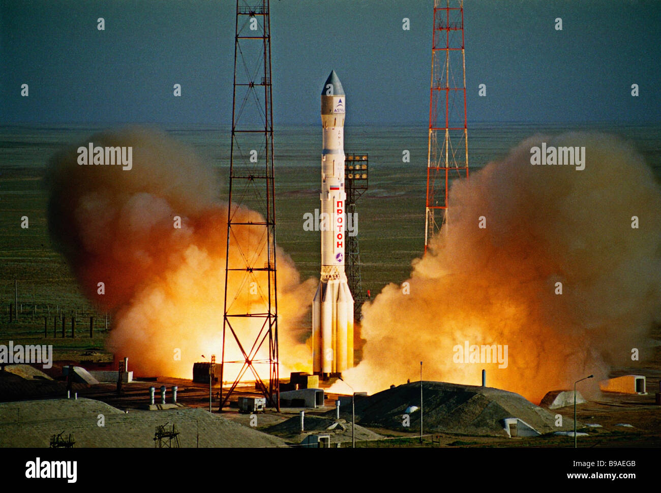 A Proton launch vehicle lifts off from the Baikonur space center Photo ...