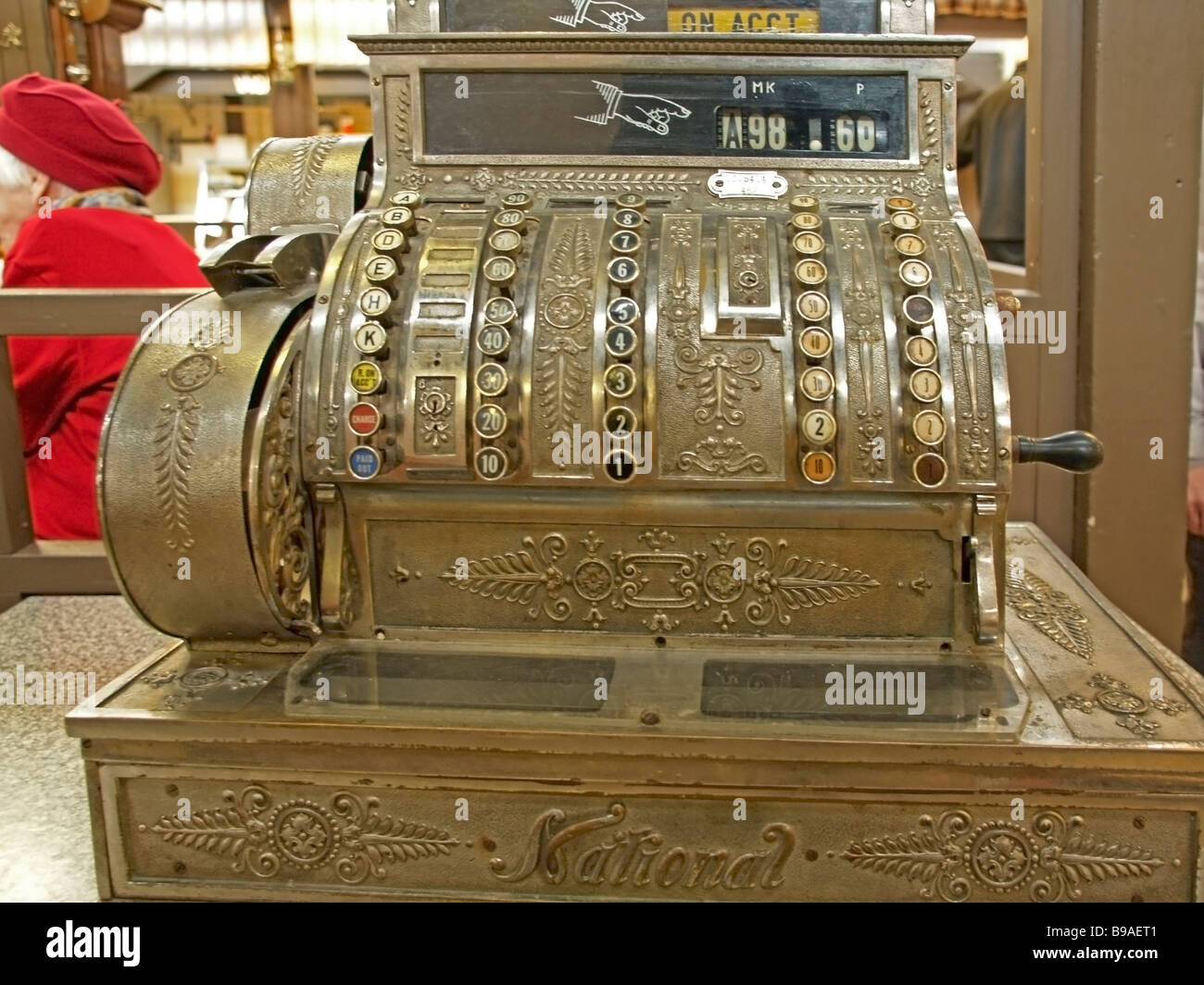 front view of an old cash register with many buttons and calculater ...