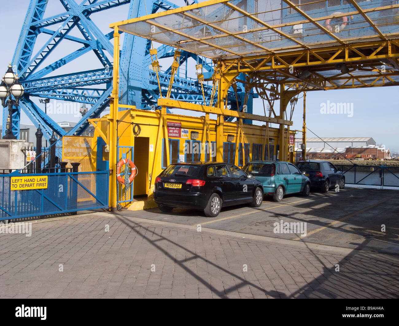 Cars loaded on to the gondola of the Transporter Bridge over the river ...