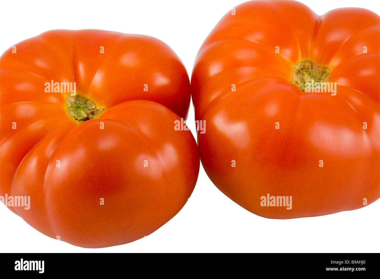 the two red tomatoes isolated on white background Stock Photo - Alamy