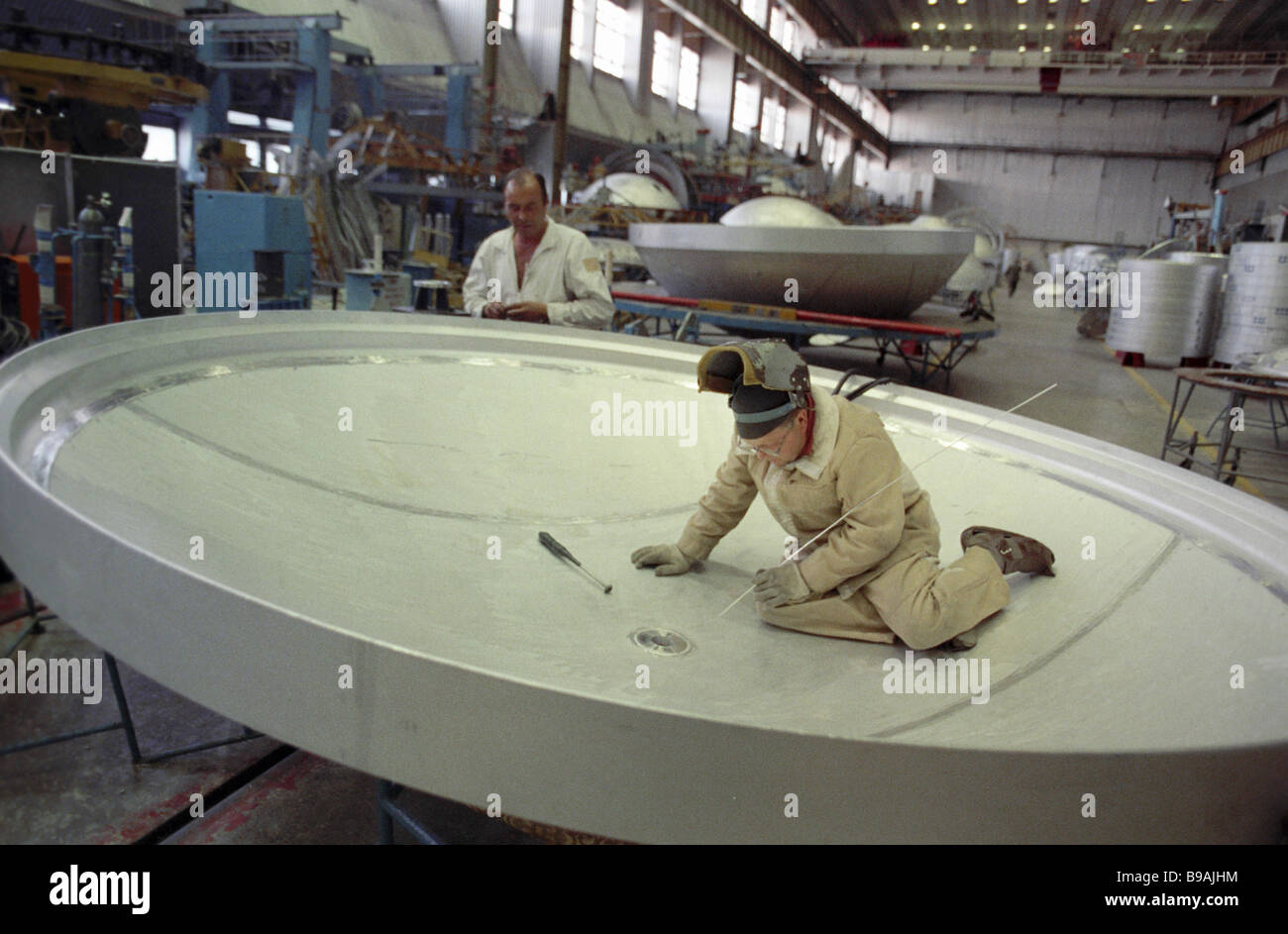 Proton booster rocket assembly at the Khrunichev Engineering Works ...