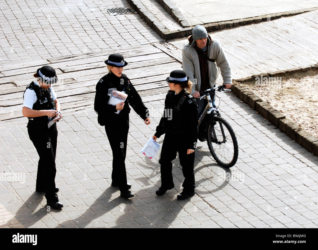 A cyclist passes three Police Community Support Officers PCSO s on ...