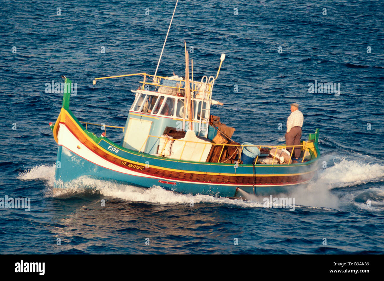 An indigenous luzzu fishing boat off Gozo Malta Maltese Islands ...