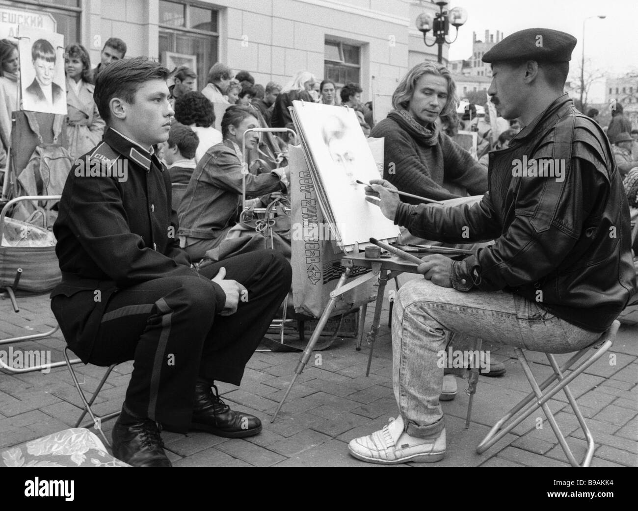 An artist drawing the portrait of a Suvorov military school student in ...