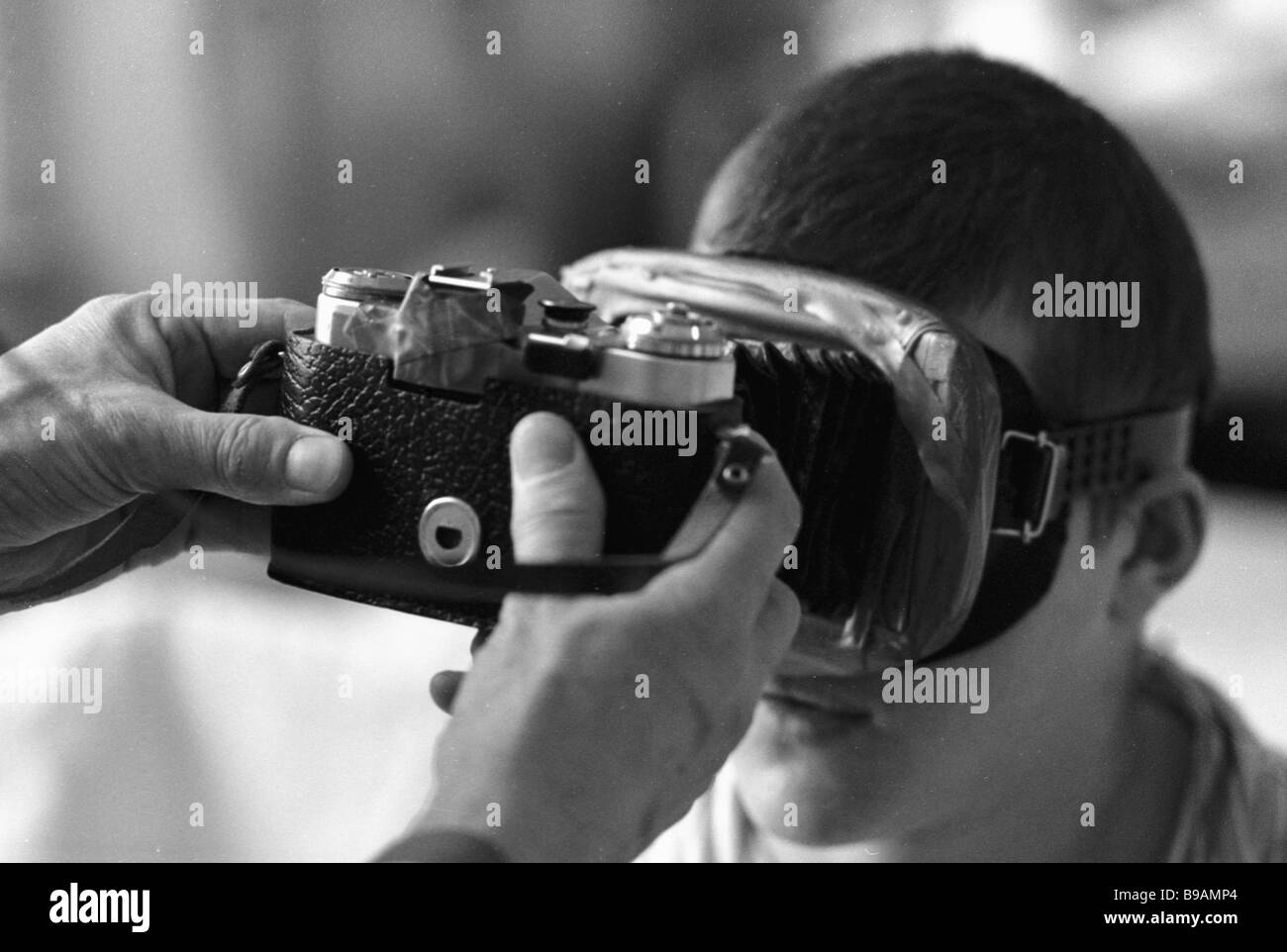 A doctor with a device which records hallucinations of mentally ill ...