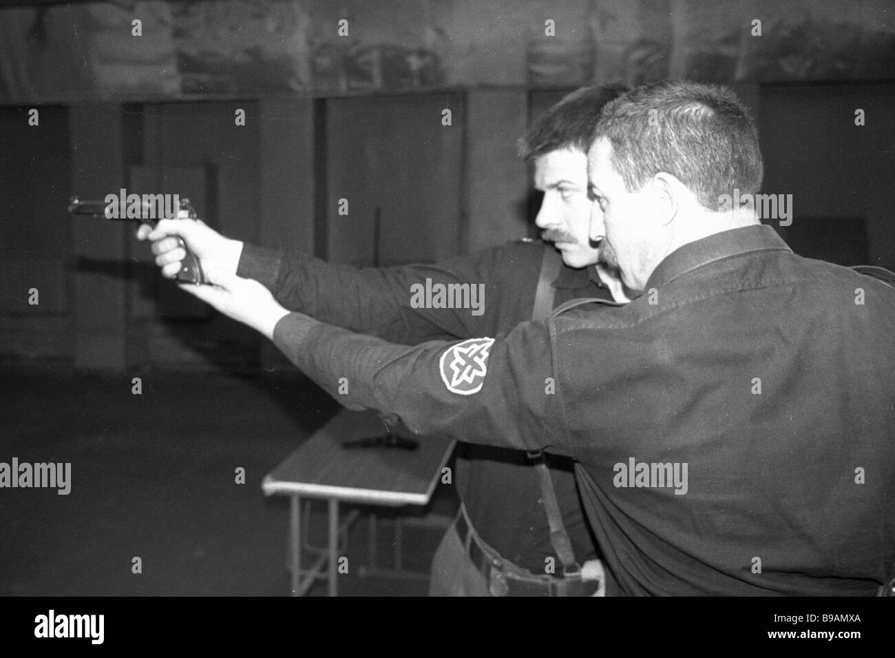 Members of the Russian National Unity movement undergo weapon training ...
