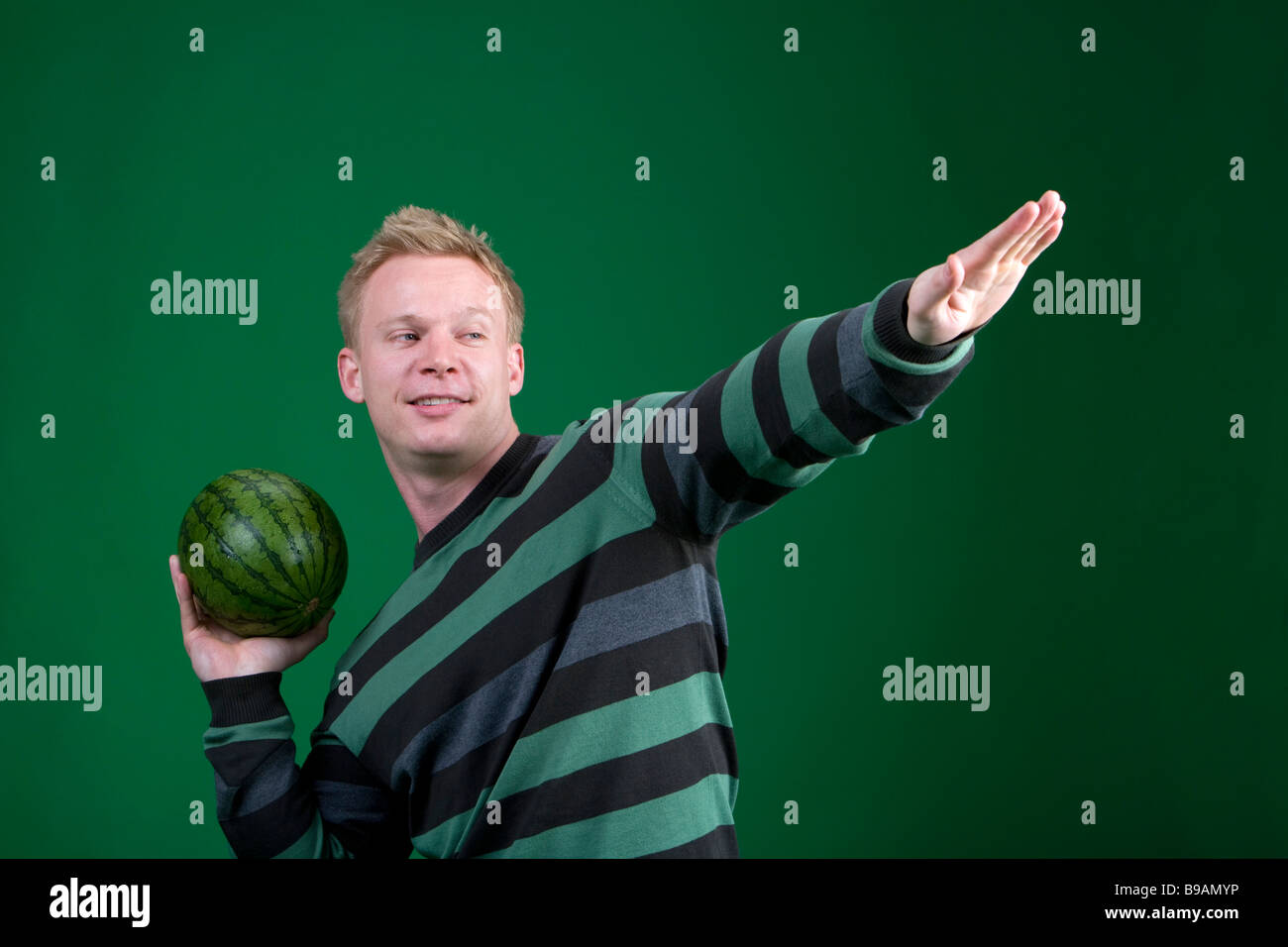 Man throwing watermelon Stock Photo - Alamy