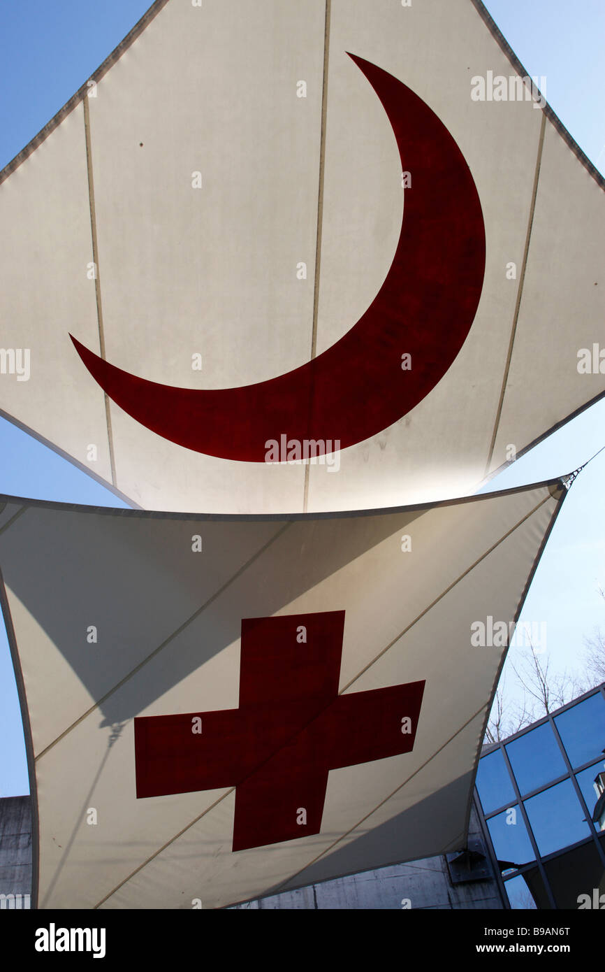 looking up at the red cross & crescent emblems which cover the entrance ...