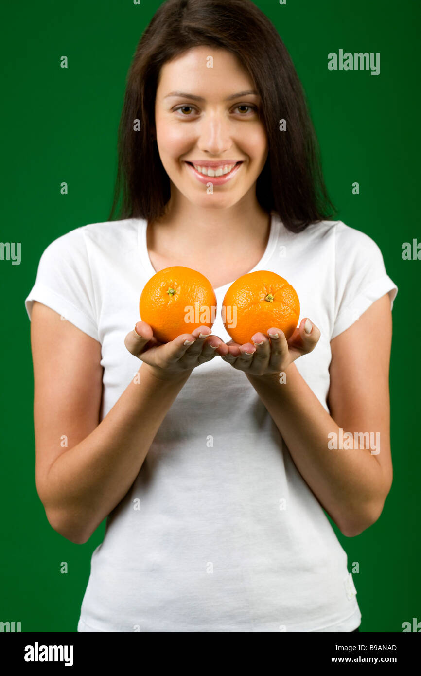 Woman holding two objects studio hi-res stock photography and images ...