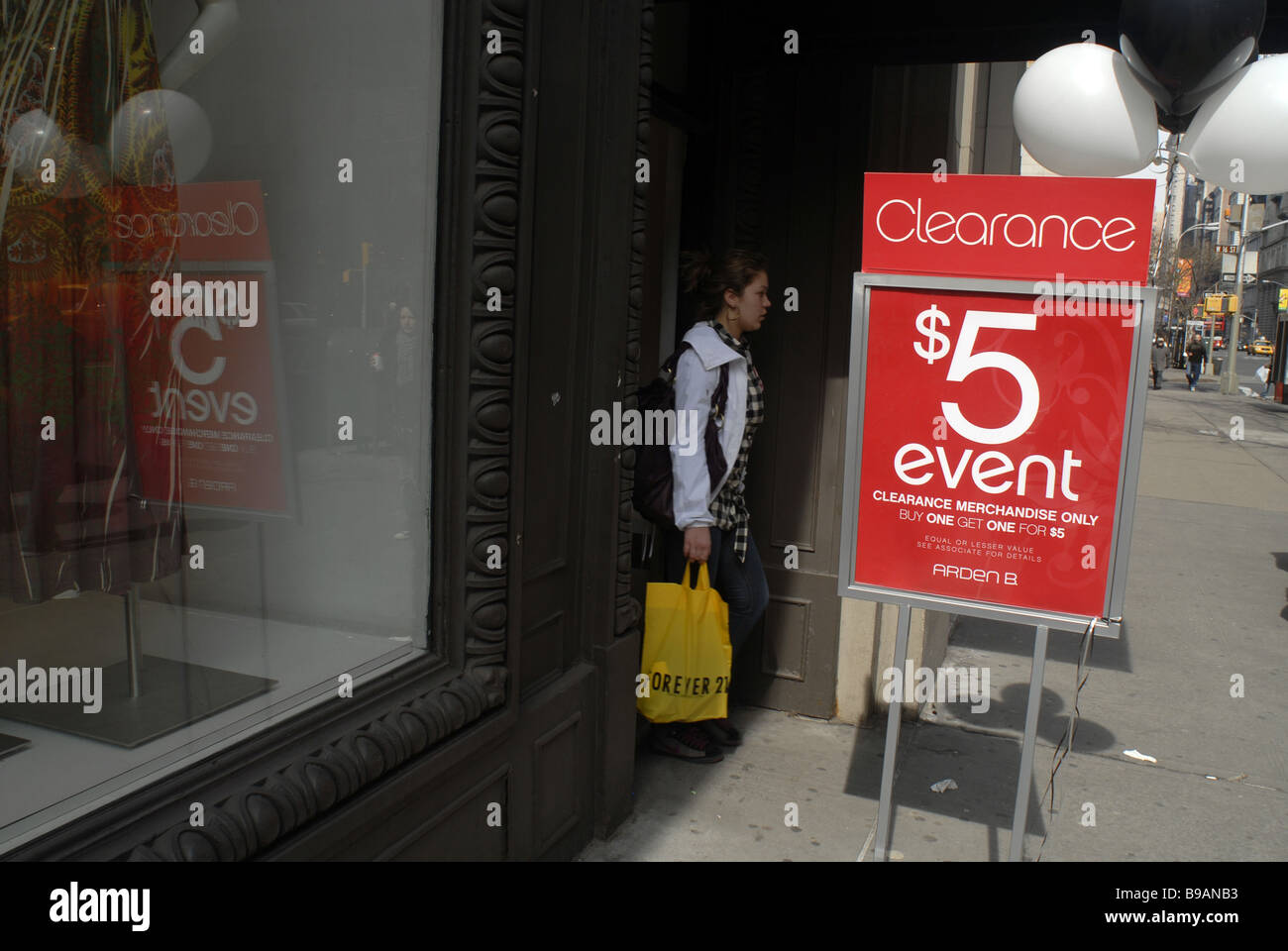 A shopper leaves an Arden B boutique store on lower Fifth Avenue in New ...