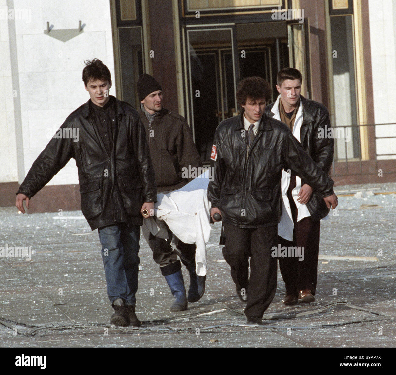 Brining a victim out of the Supreme Soviet building during the October ...