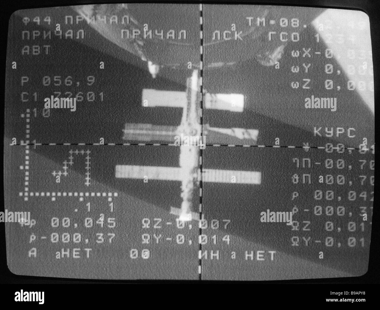 Orbital station docking with a transport aircraft on monitors at the ...