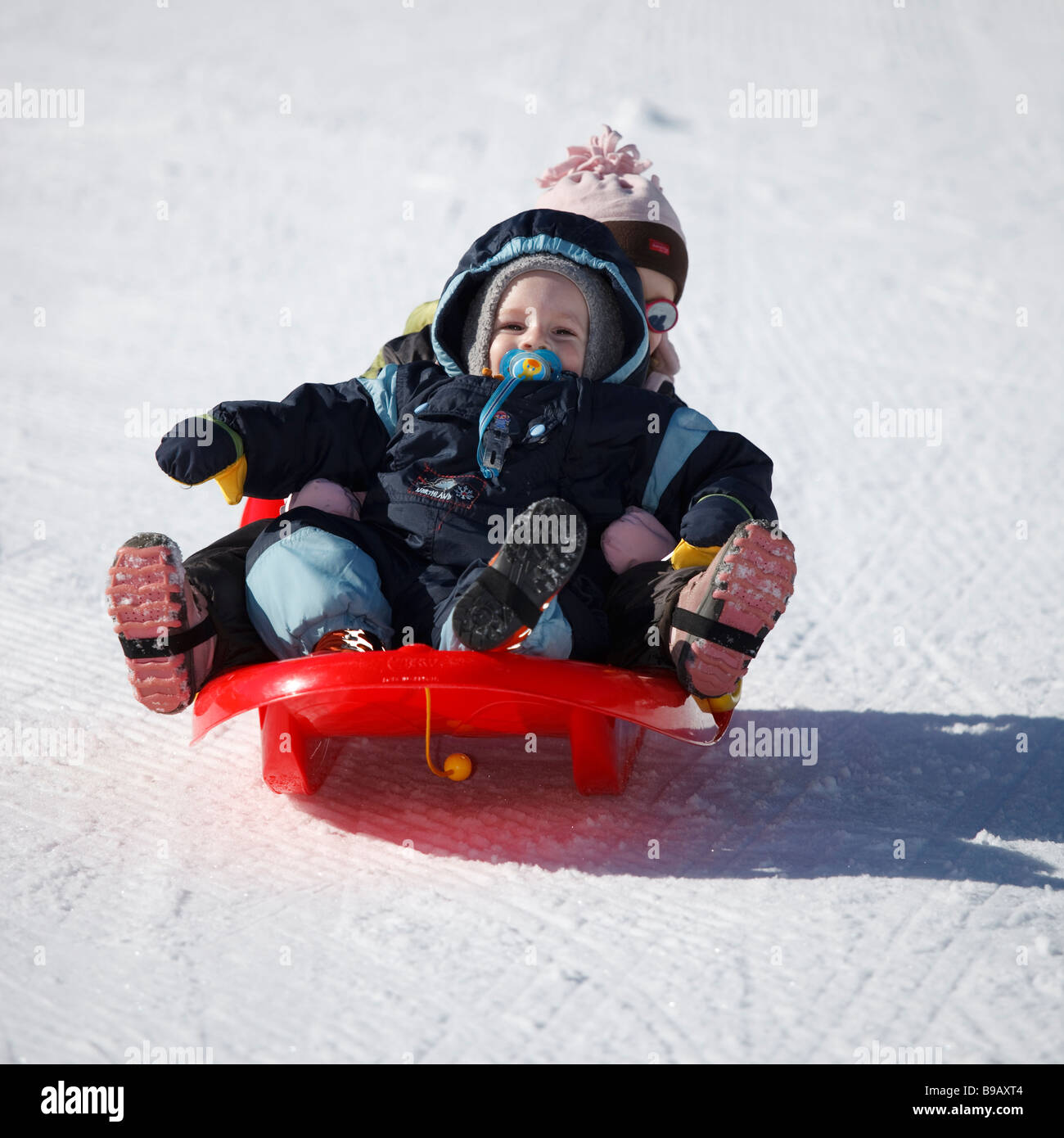 children on sled Stock Photo - Alamy