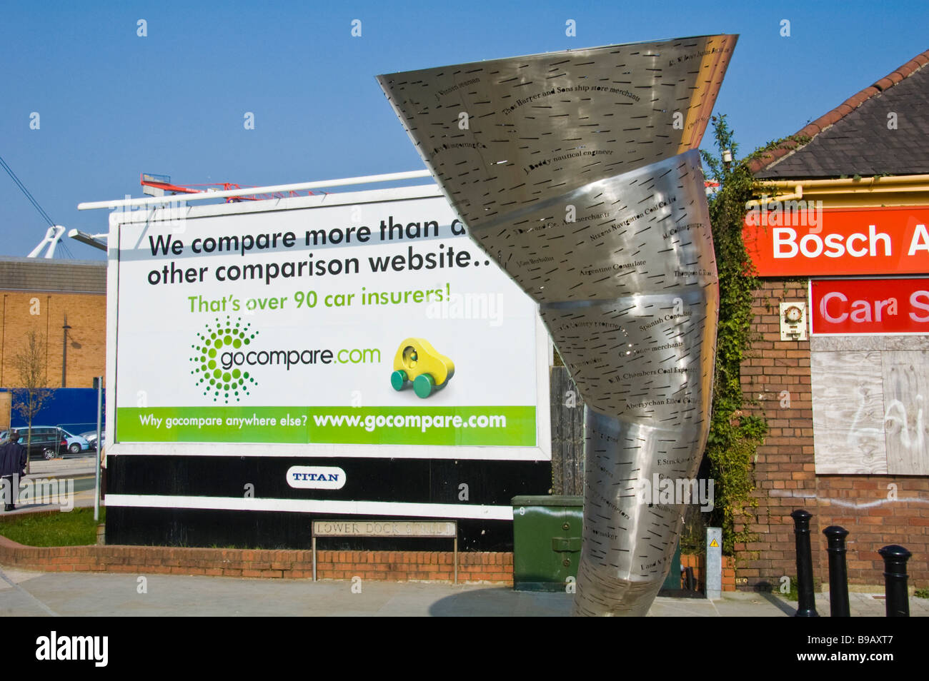 Advertising billboard for gocompare com next to artwork sculpture in ...
