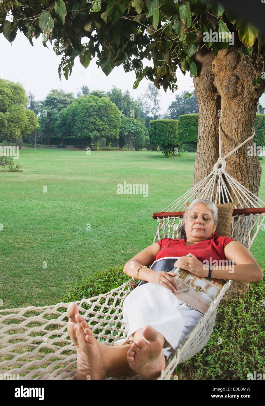 Woman sleeping in a hammock, New Delhi, India Stock Photo - Alamy