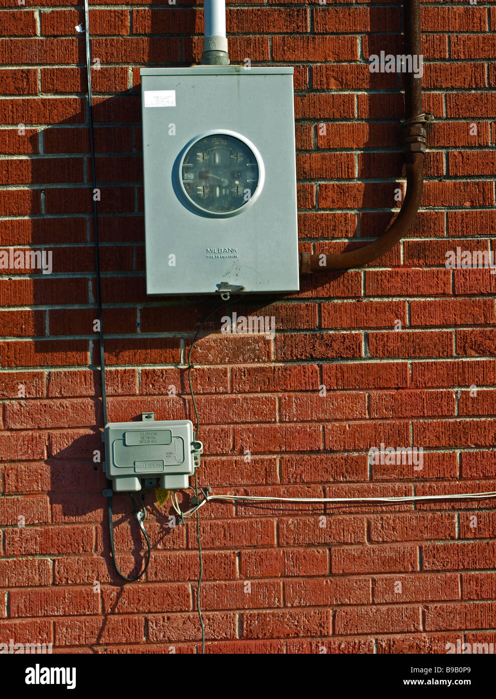 powerbox wires electrical pipes on bright brick wall shadows Stock ...