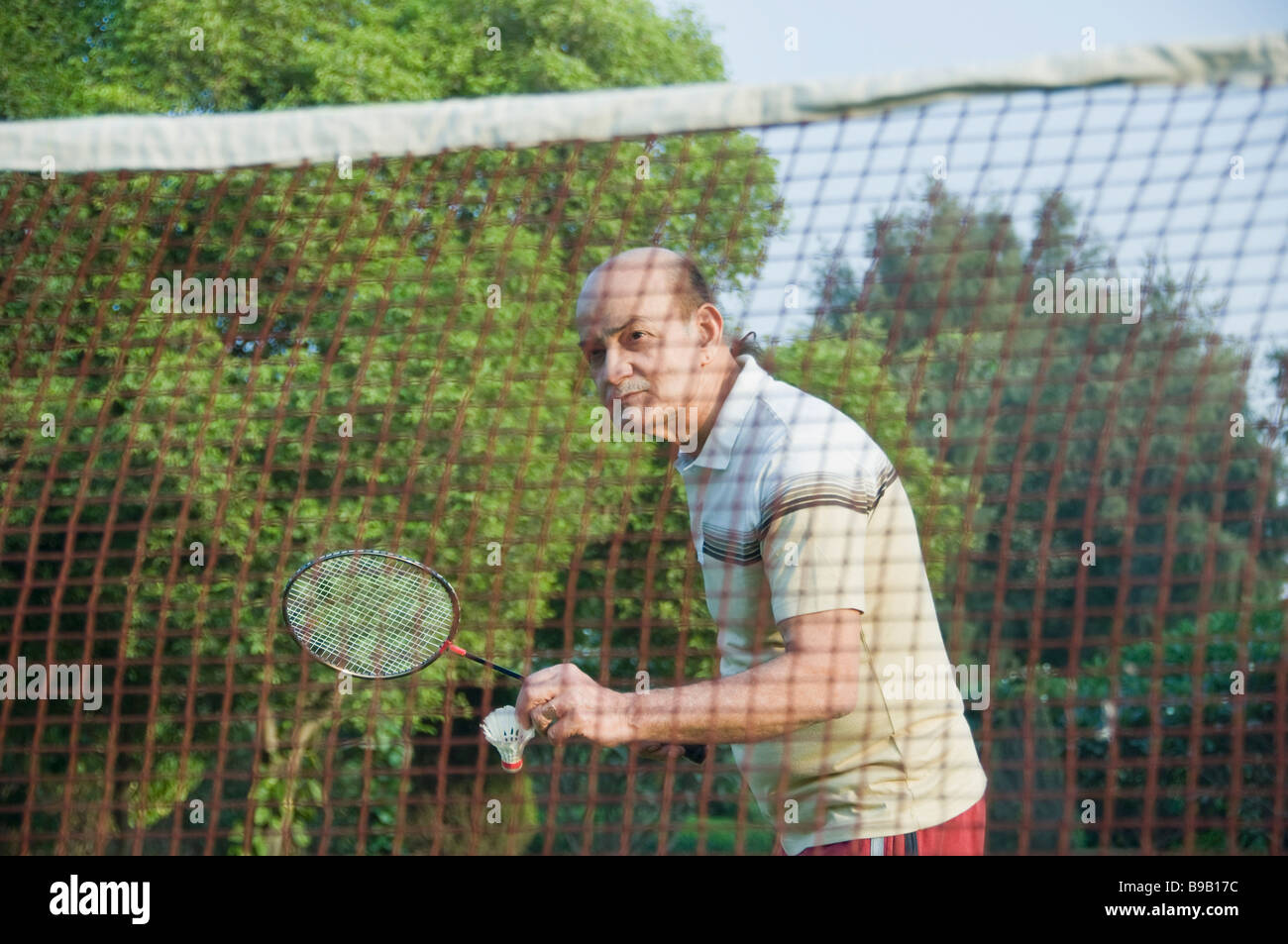 Man playing badminton in a park, New Delhi, India Stock Photo - Alamy
