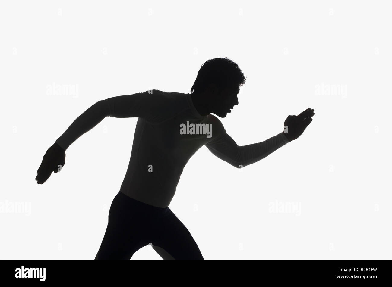 Silhouette of a male athlete running Stock Photo - Alamy