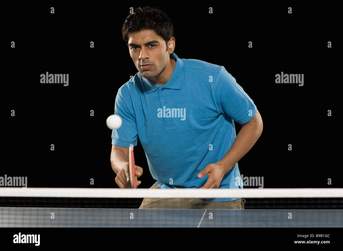 Man playing table tennis Stock Photo - Alamy