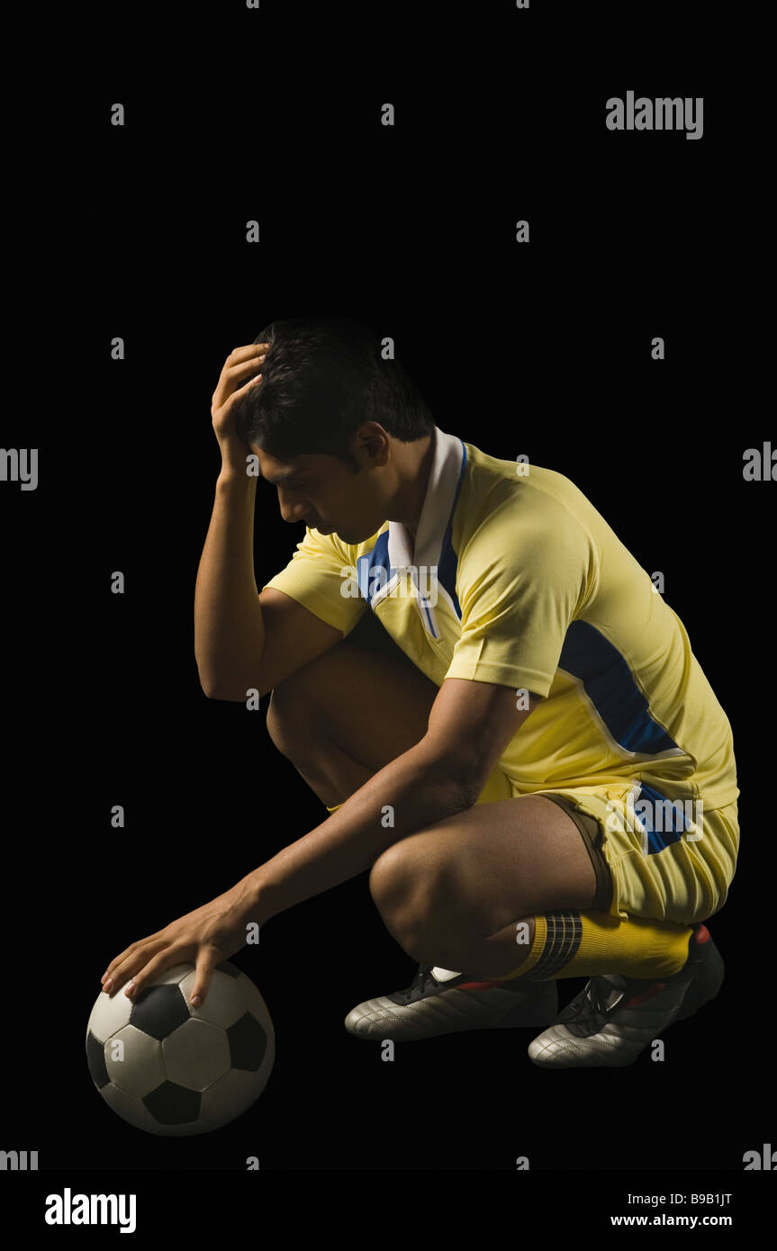 Soccer player head in hands hi-res stock photography and images - Alamy
