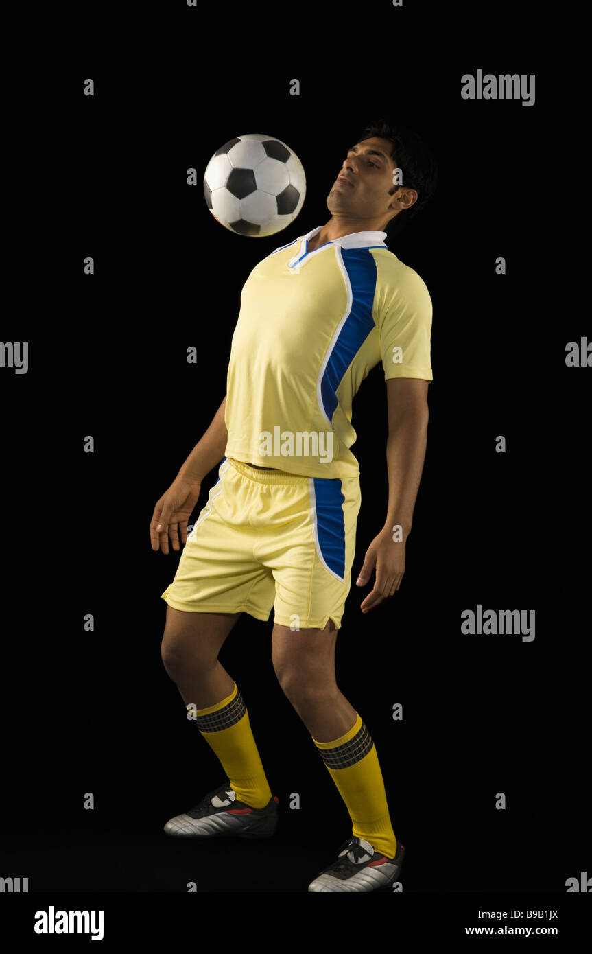 Man playing soccer Stock Photo - Alamy