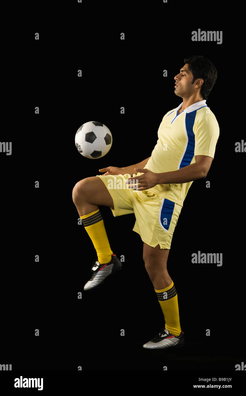 Man playing soccer Stock Photo - Alamy