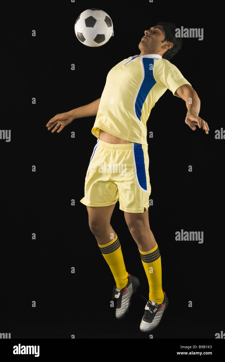 Man playing soccer Stock Photo - Alamy