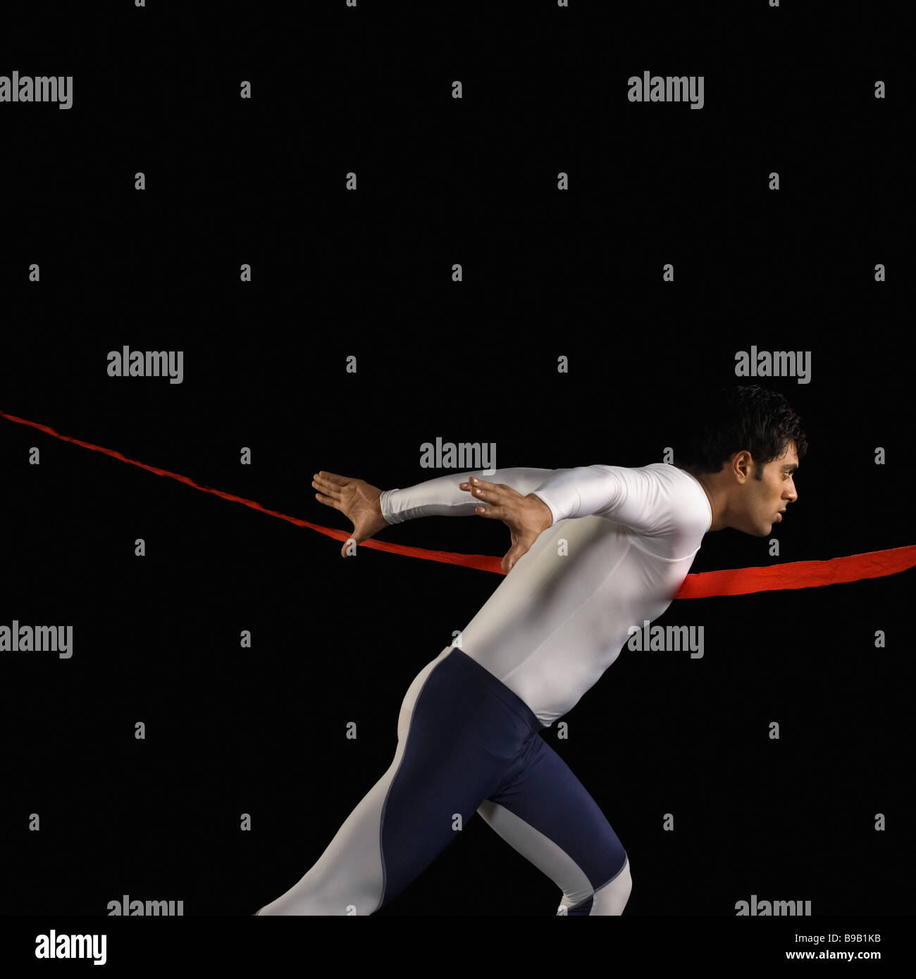 Male athlete crossing finish line hi-res stock photography and images ...