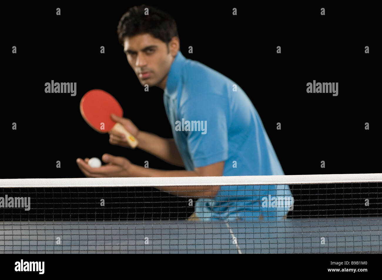 Man playing table tennis Stock Photo - Alamy